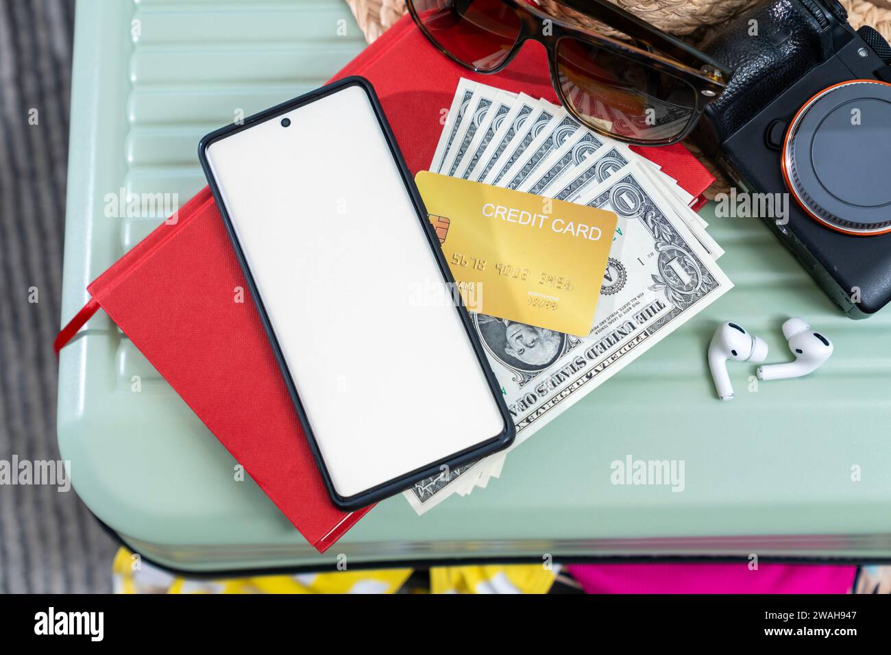 Credit cards and cash ready for travel Stock Photo - Alamy
