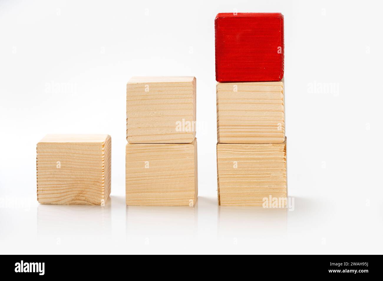 Closeup view of a stack of stairs of wooden cubes isolated over a white ...