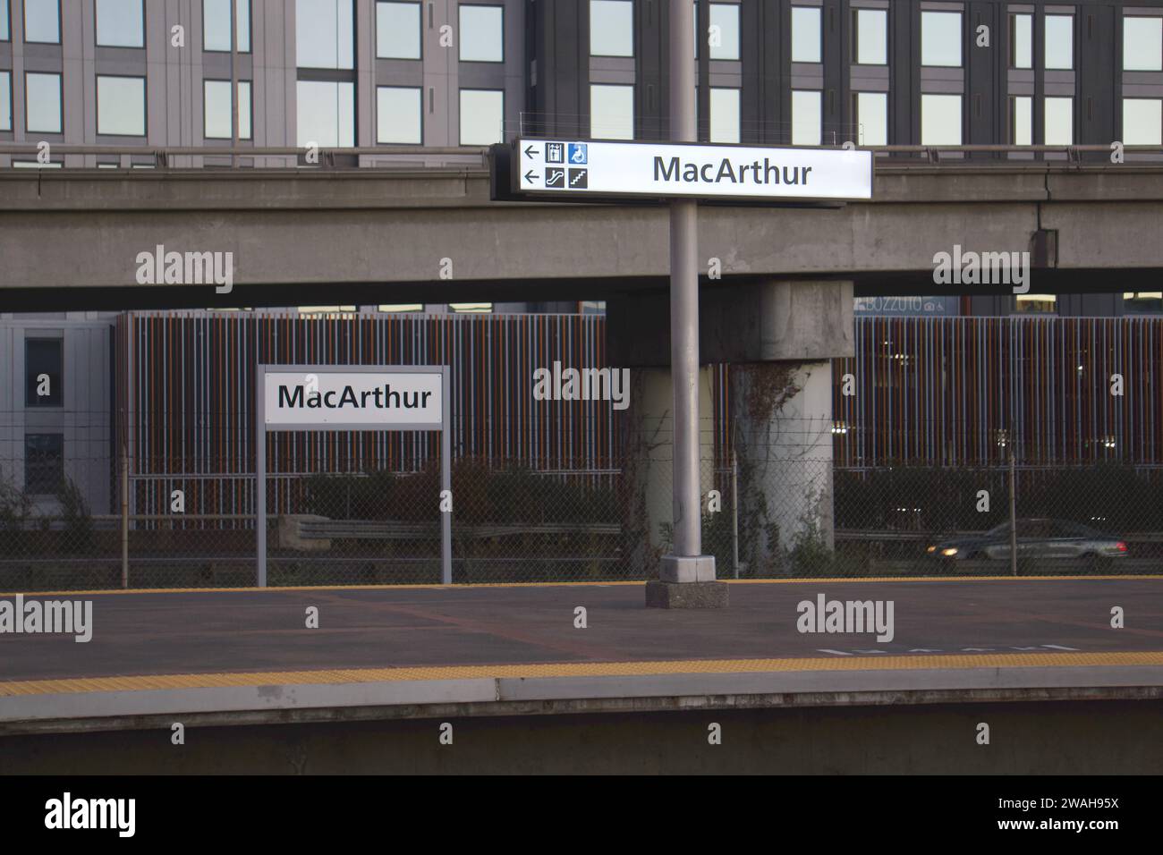 MacArthur BART station. Public train platform for the Bay Area Rapid ...