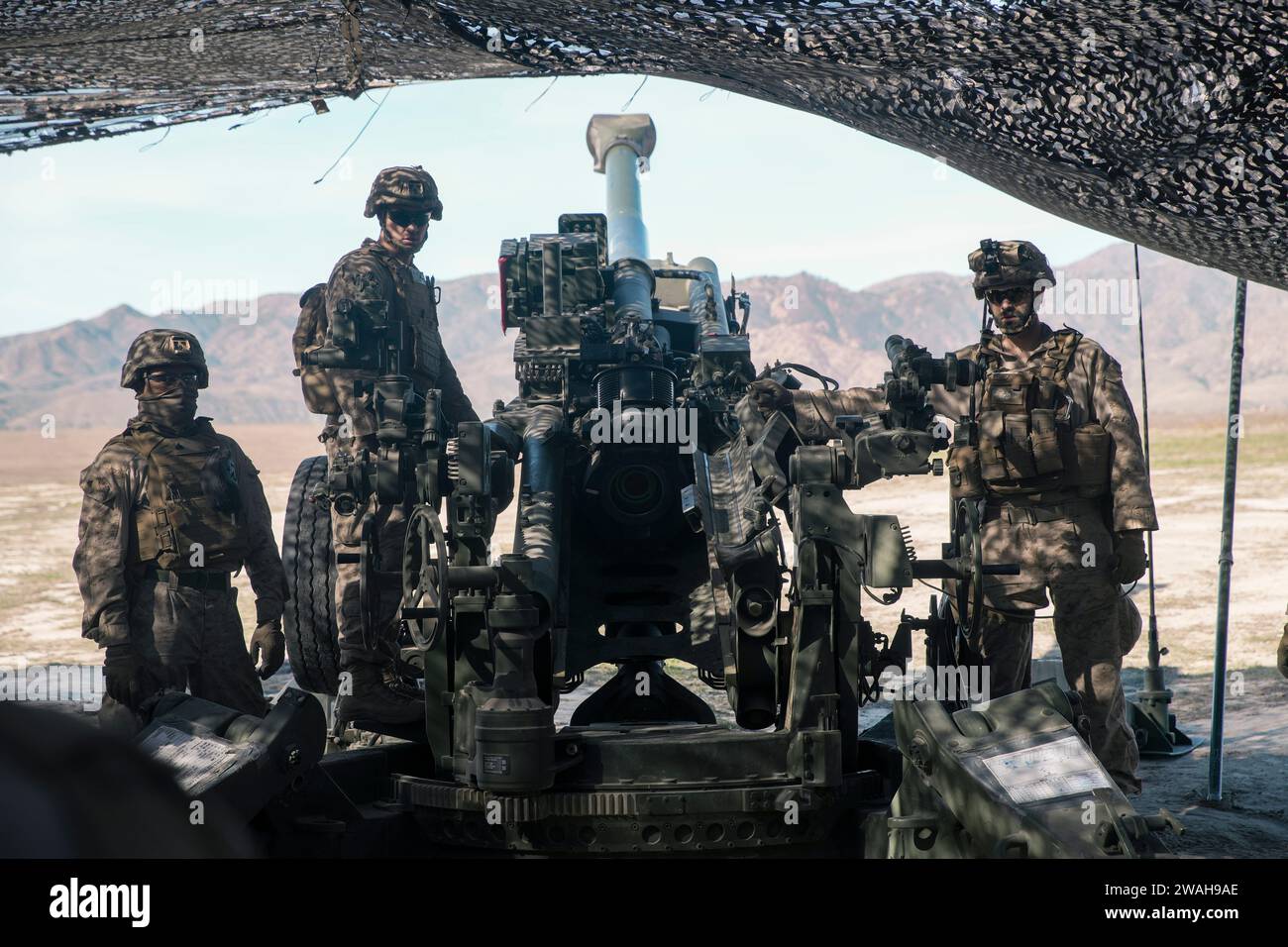U.S. Marine Corps field artillery cannoneers assigned to Charlie ...