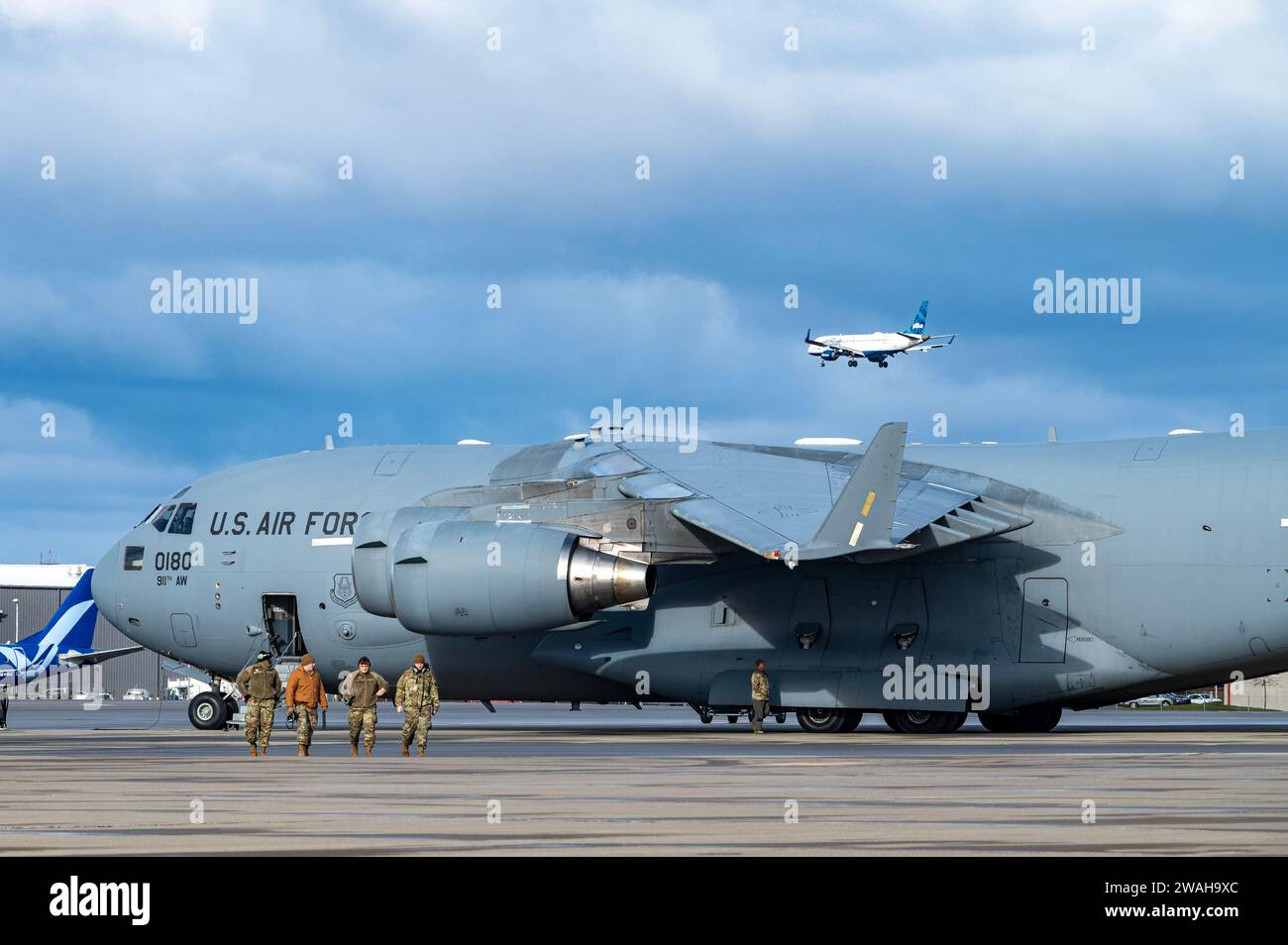 Maintainers assigned to the 911th Aircraft Maintenance Squadron walk ...
