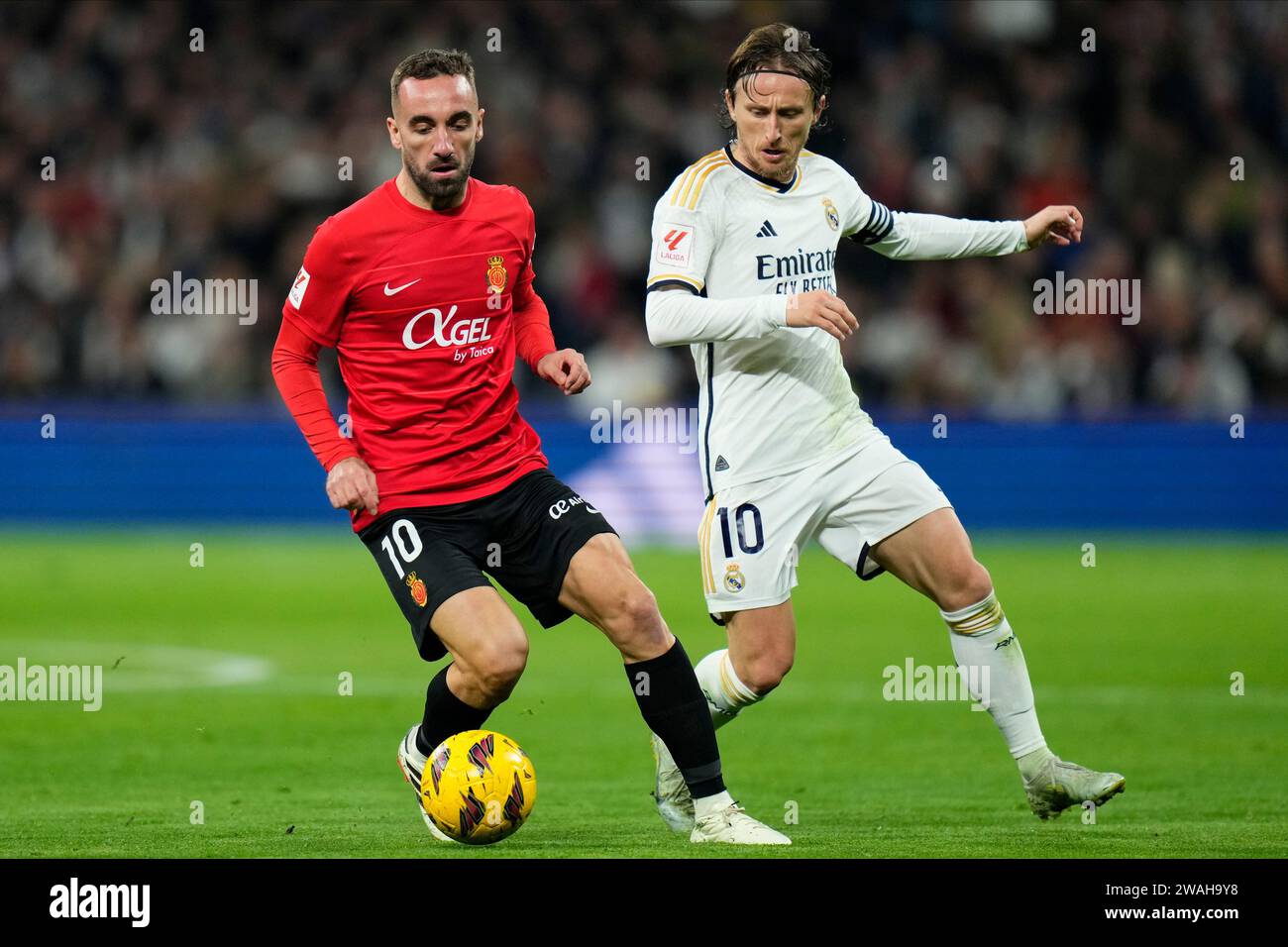 Madrid, Spain. 03rd Jan, 2024. Sergi Darder of RCD Mallorca and Luka ...