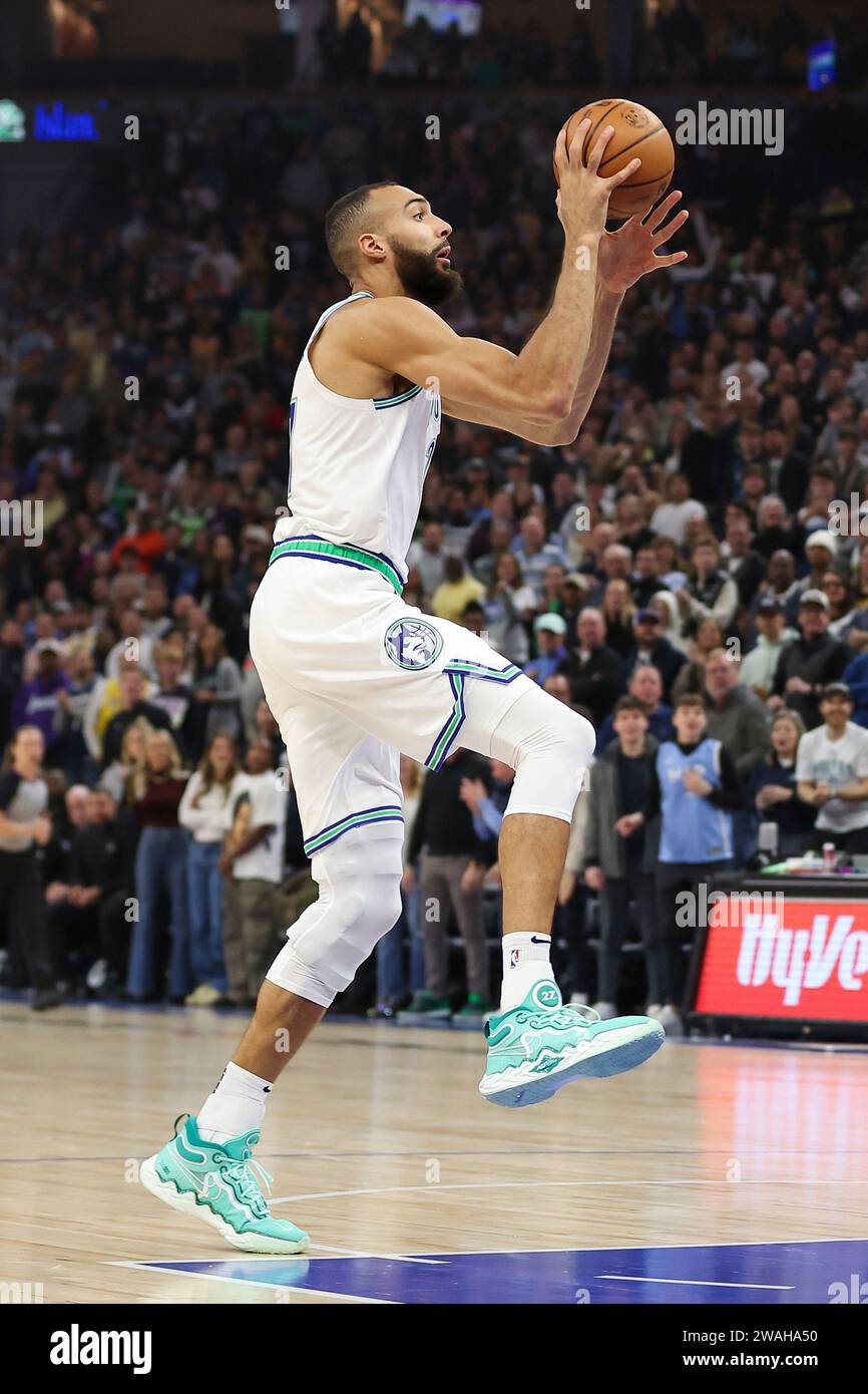 Minnesota Timberwolves center Rudy Gobert (27) passes the ball during the first half of an NBA ...