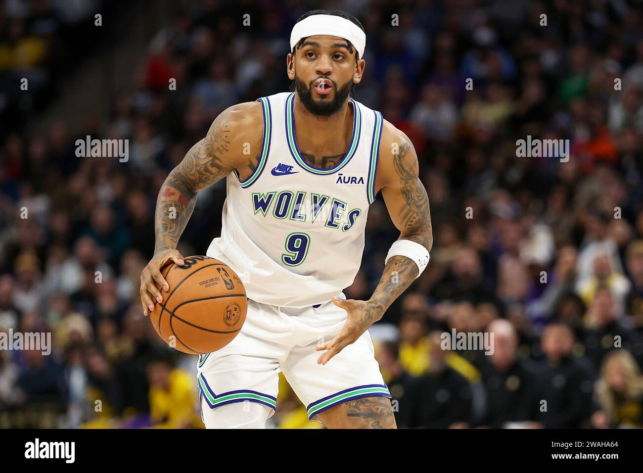 Minnesota Timberwolves guard Nickeil Alexander-Walker (9) handles the ...