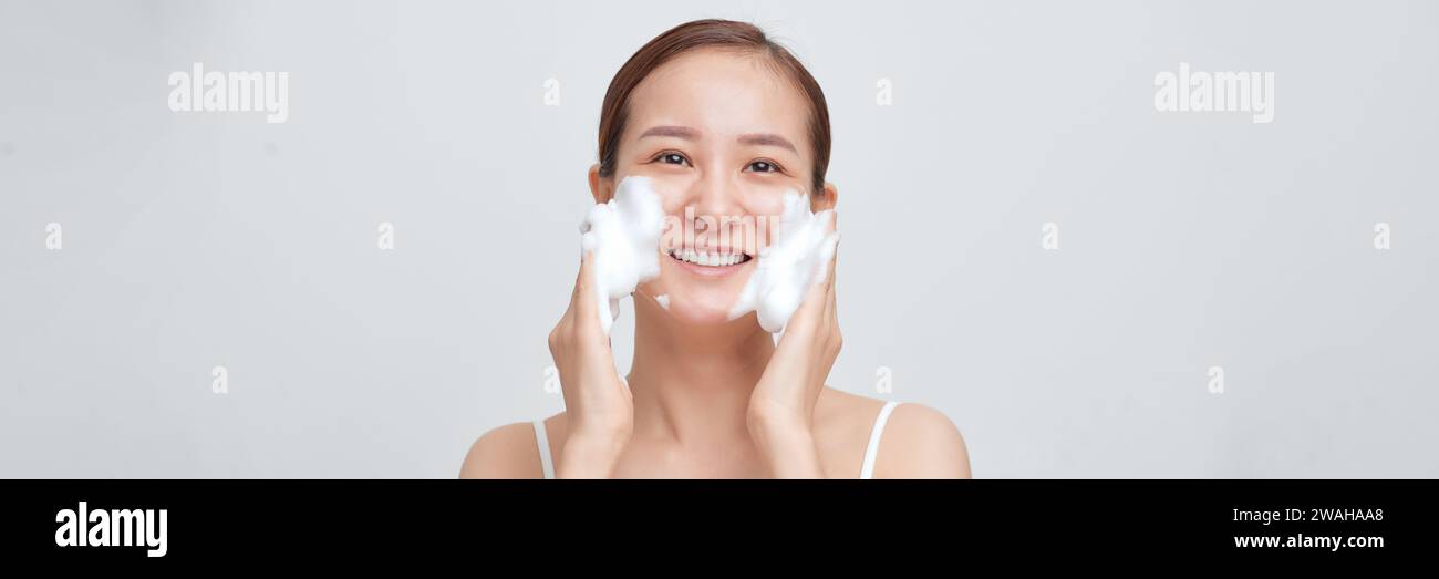happy woman with foaming facial cleanser washing face isolated on white banner background Stock ...