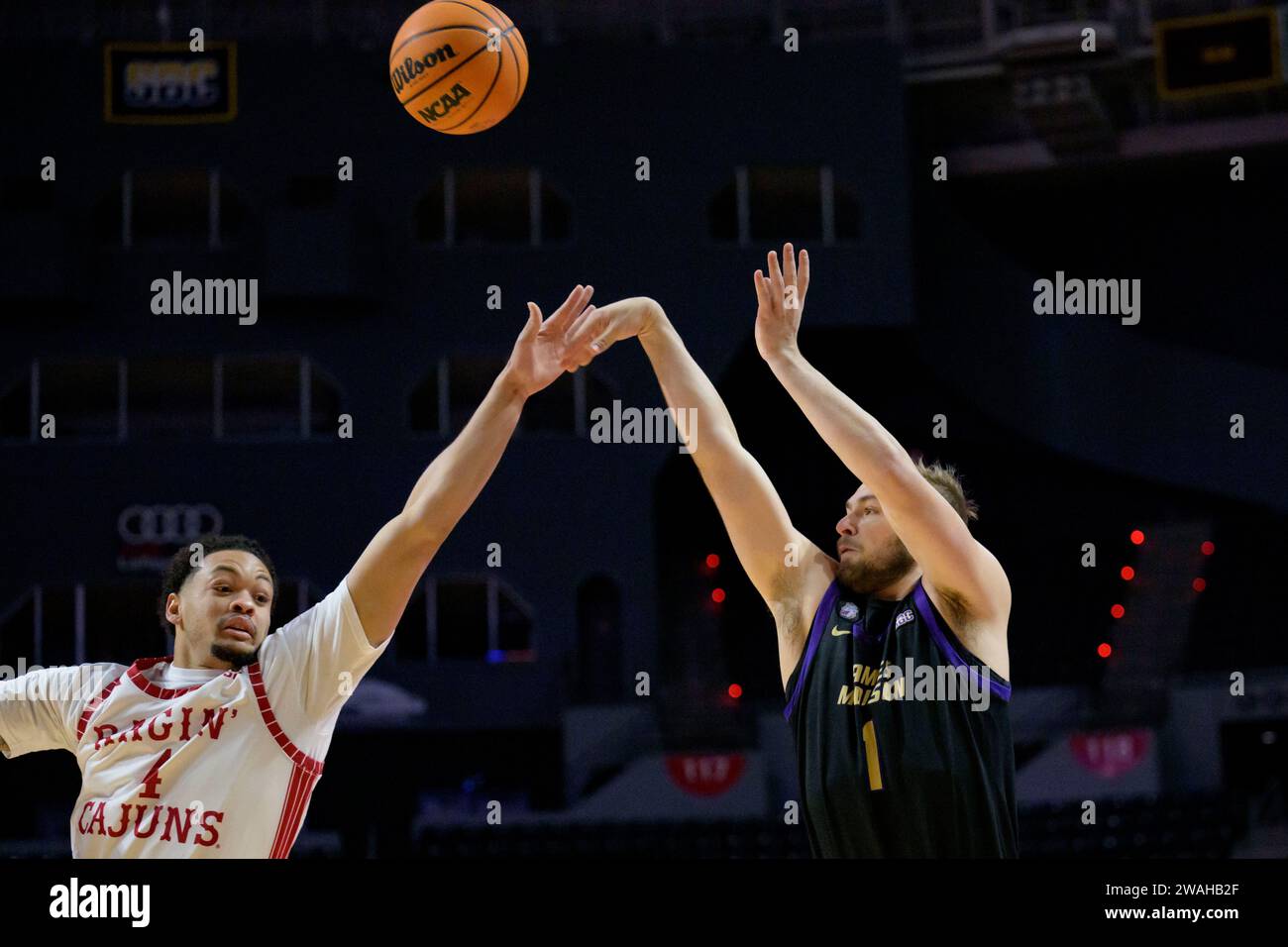 James Madison guard Noah Freidel (1) shoots a 3-point basket against ...