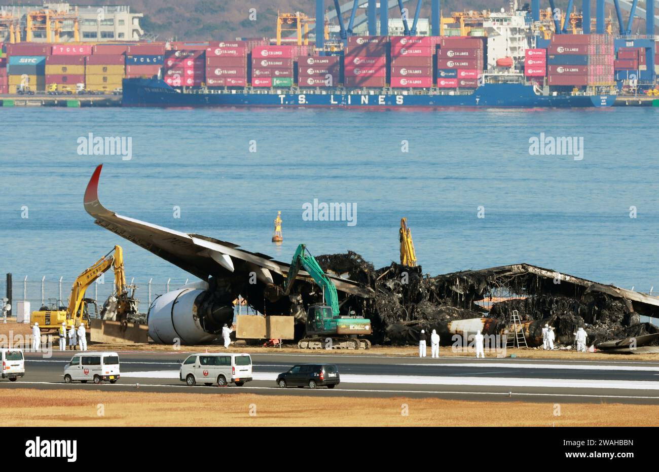 A removing work of a burnt Japan Airlines Flight 516 remains on the ...