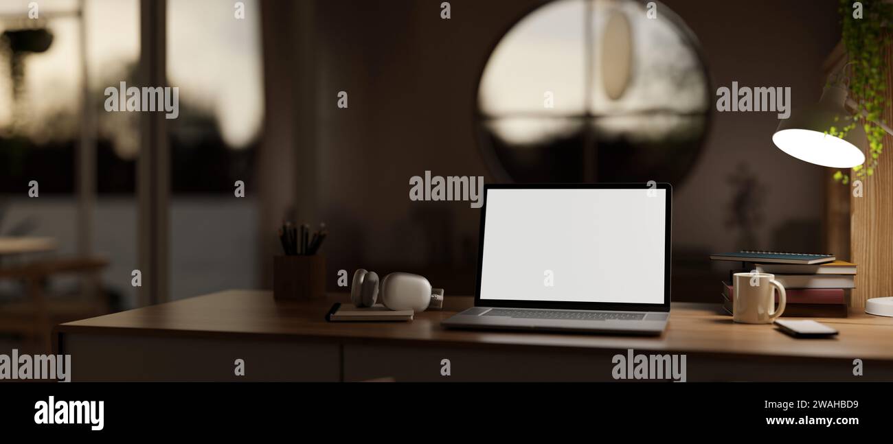 A cosy, modern home workspace at night with a white-screen laptop ...