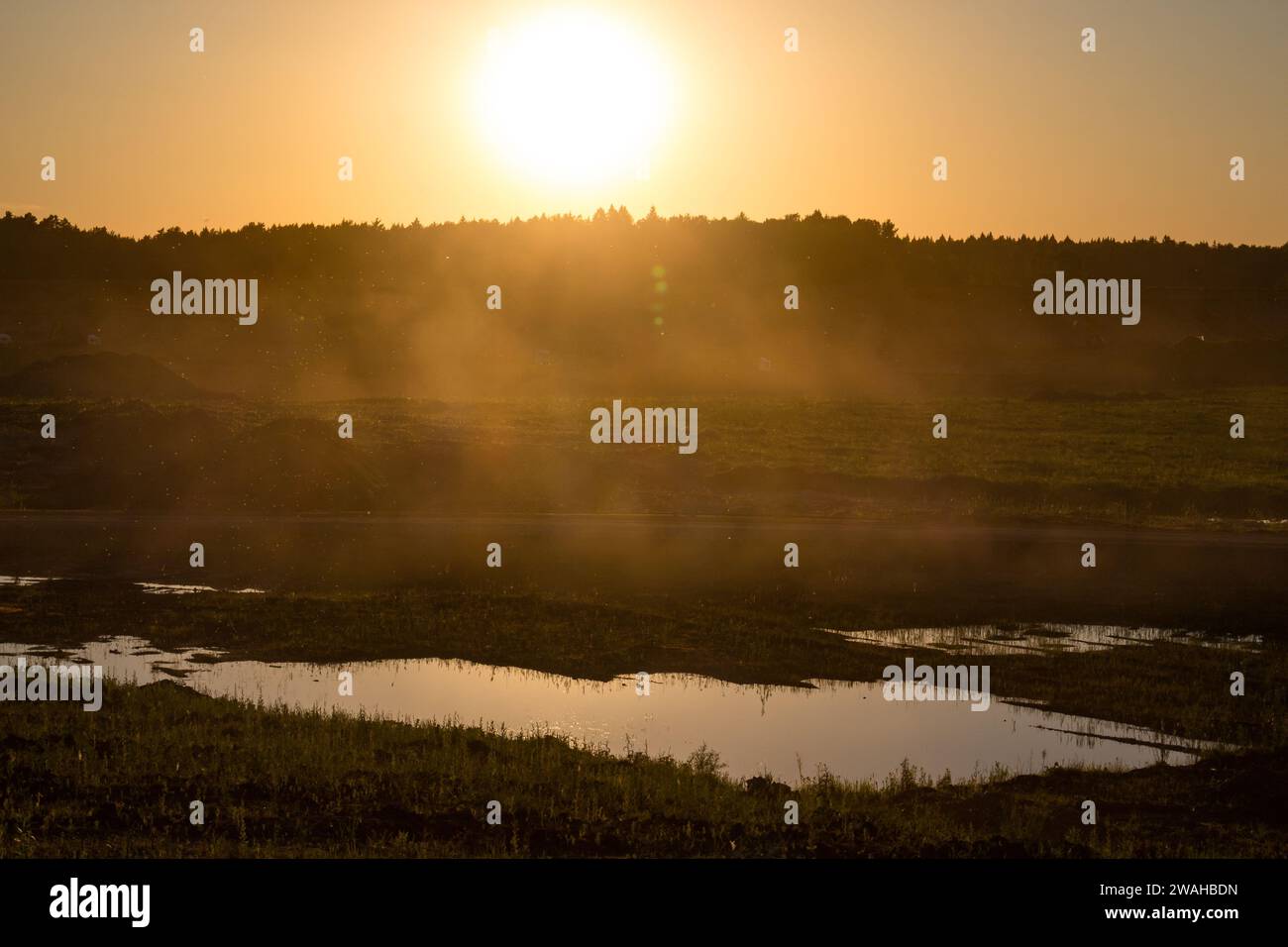 Heavy sand dust raised at an active sand quarry in the sun Stock Photo ...