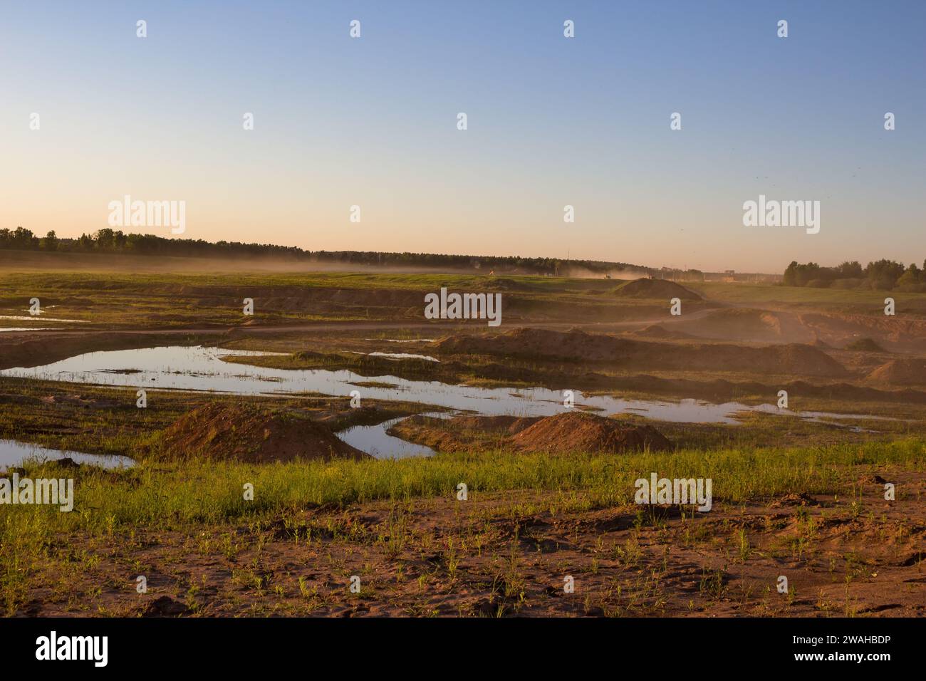 Heavy sand dust raised at an active sand quarry in the sun Stock Photo ...