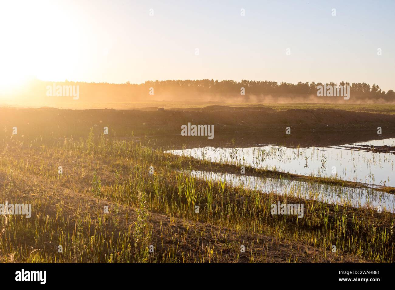 Heavy sand dust raised at an active sand quarry in the sun Stock Photo ...