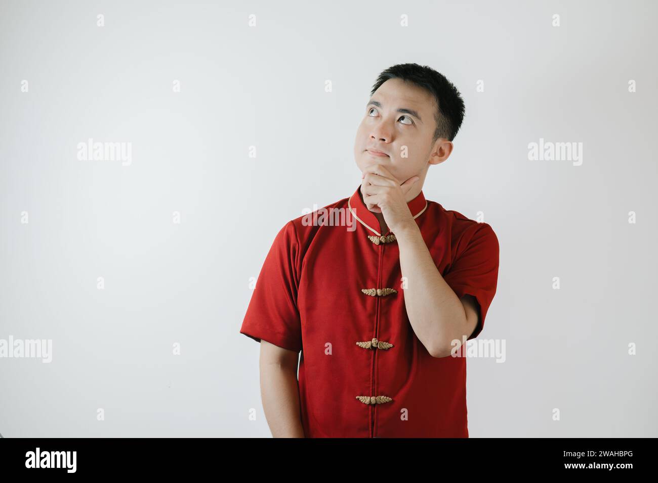 Confused face of Asian man wearing Chinese traditional cloth or ...