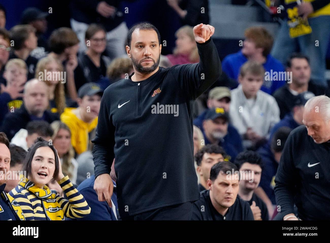 Minnesota head coach Ben Johnson signals from the sideline during the ...