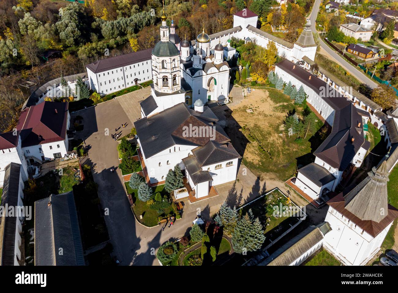 Landscape view of a picturesque medieval Orthodox monastery with white ...