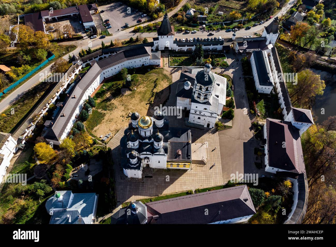 Landscape view of a picturesque medieval Orthodox monastery with white ...