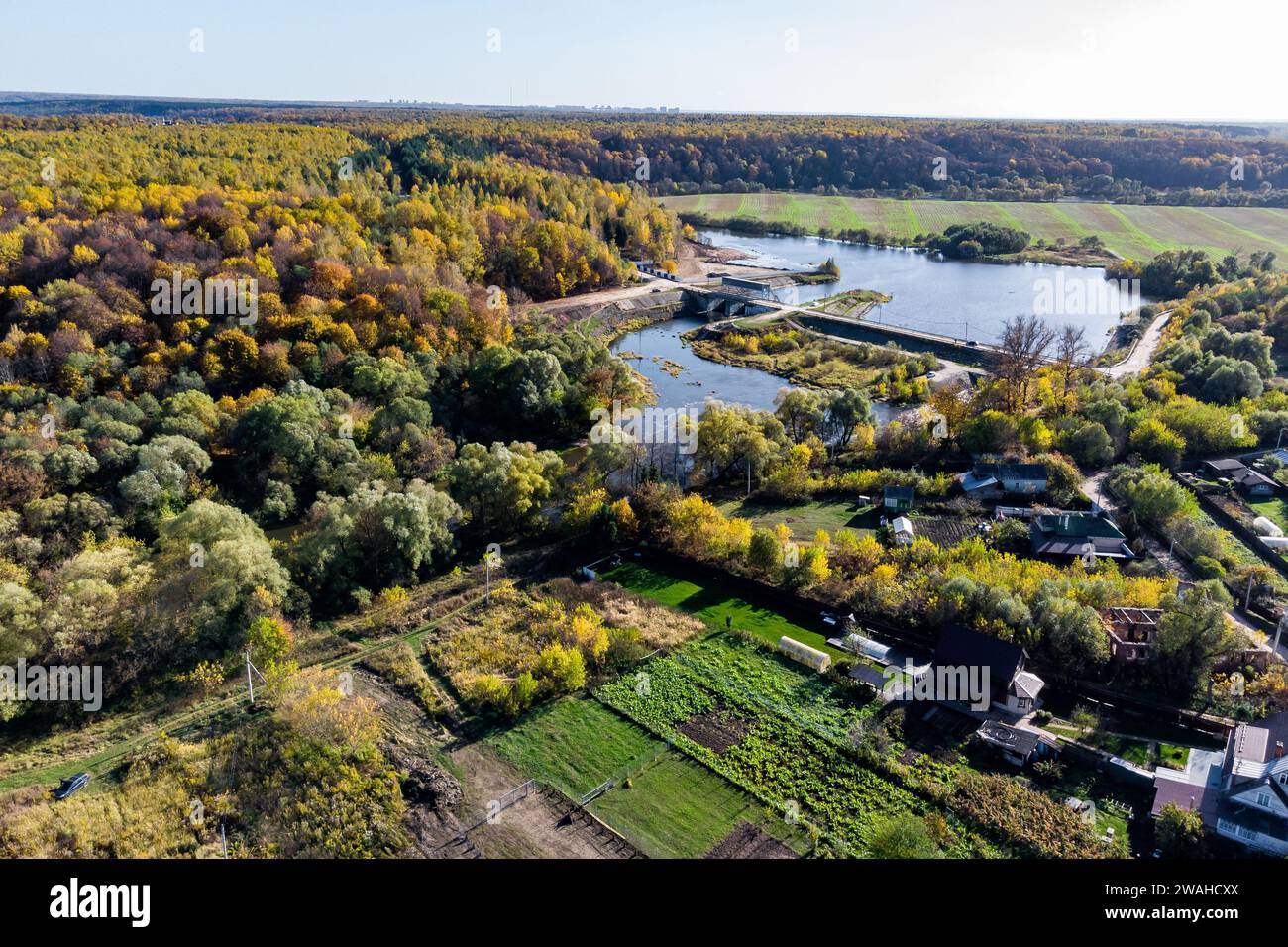 Aerial view of the countryside near the reservoir on the river. Dam on ...