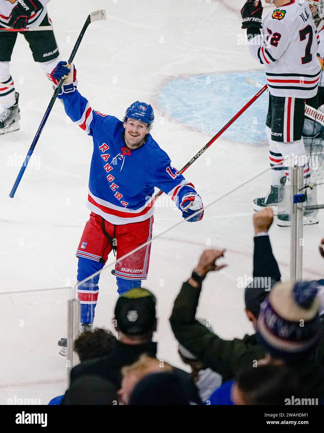 New York Rangers left wing Alexis Lafreniere, center, celebrates after ...