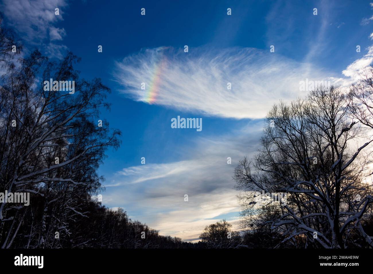 Stratus cloud with rare rainbow effect on blue sky Stock Photo - Alamy