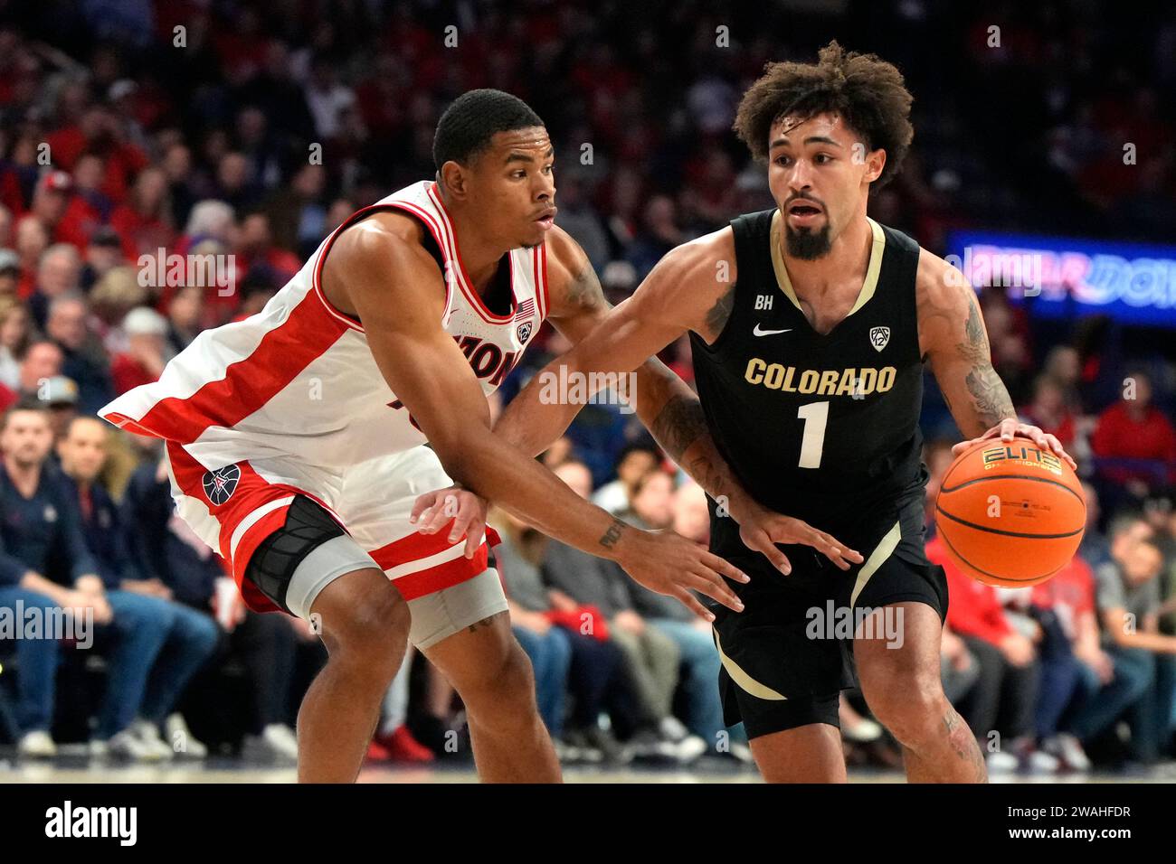 Colorado guard J'Vonne Hadley (1) drives on Arizona forward Keshad ...