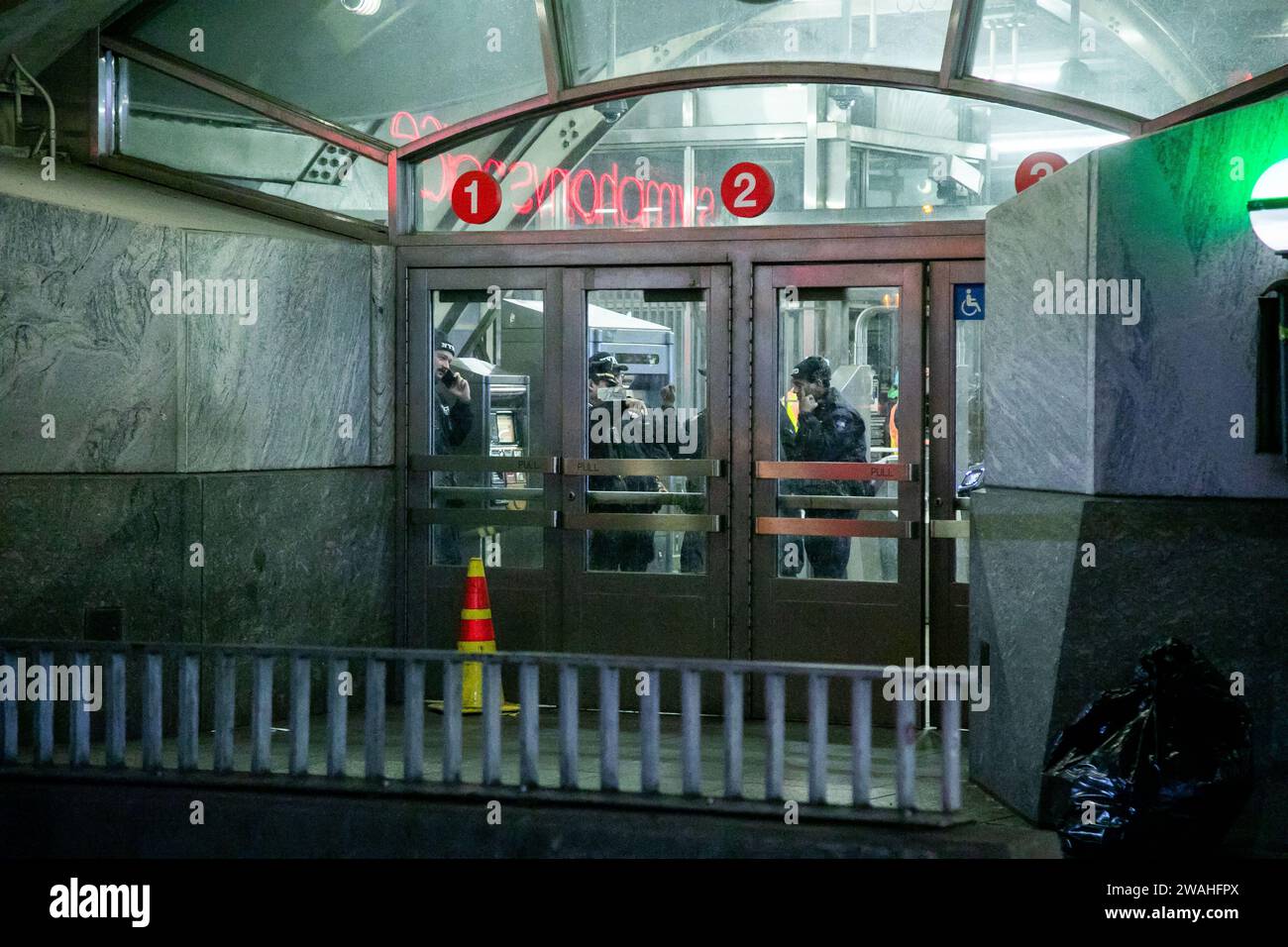 New York, USA. 4th Jan, 2024. Staff members respond to the collision of ...