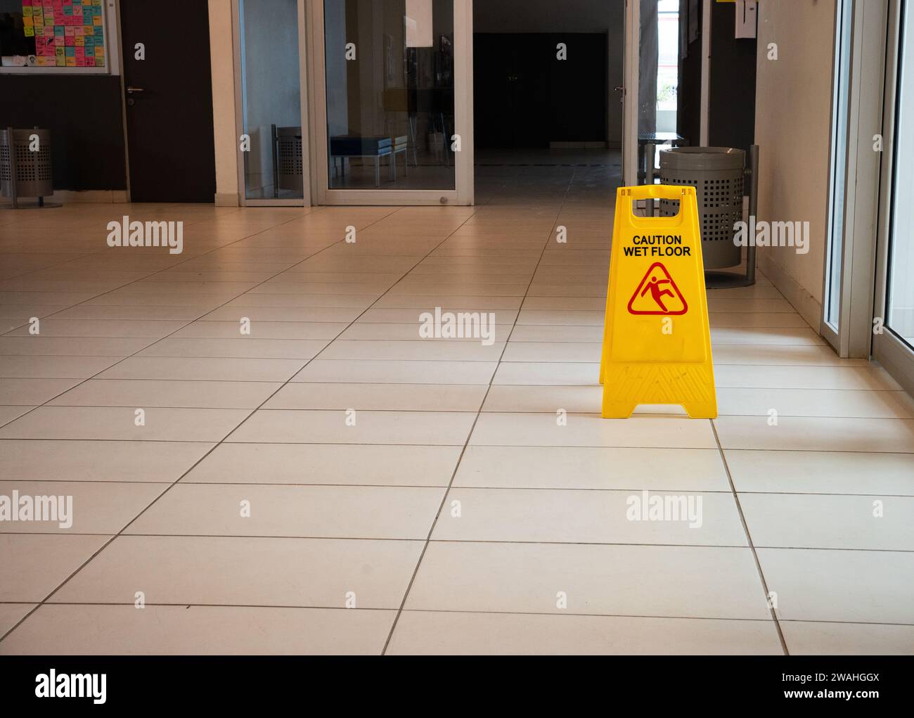 caution wet floor sign on a hall Stock Photo - Alamy