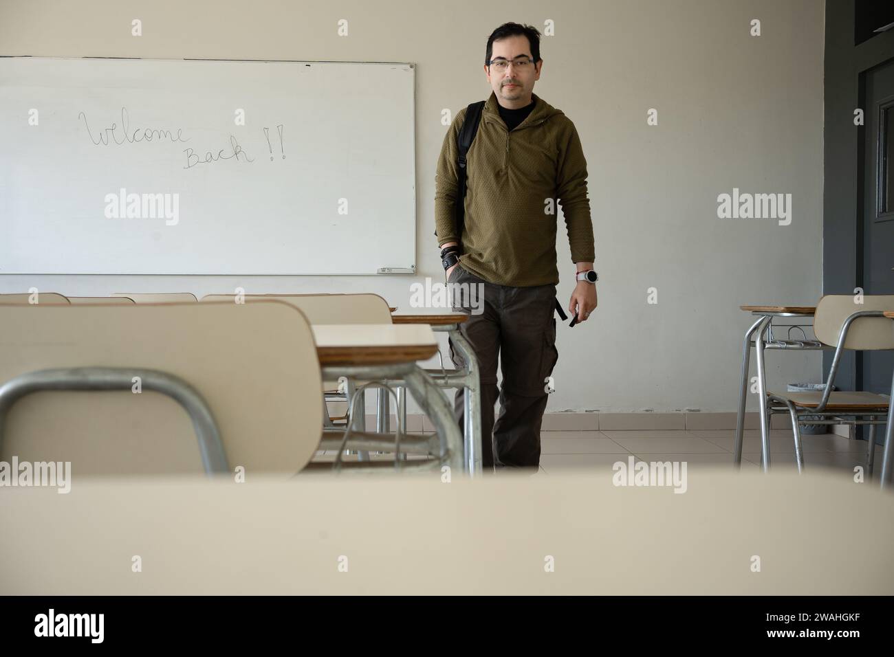 man returning to class, back to school Stock Photo - Alamy