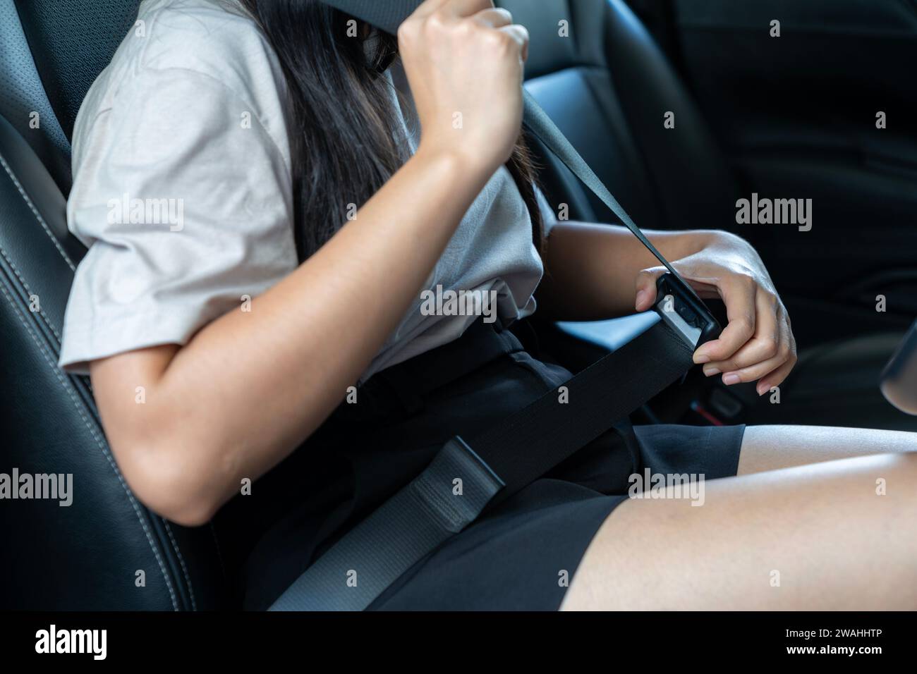 Wearing a seatbelt for safety while driving Stock Photo - Alamy