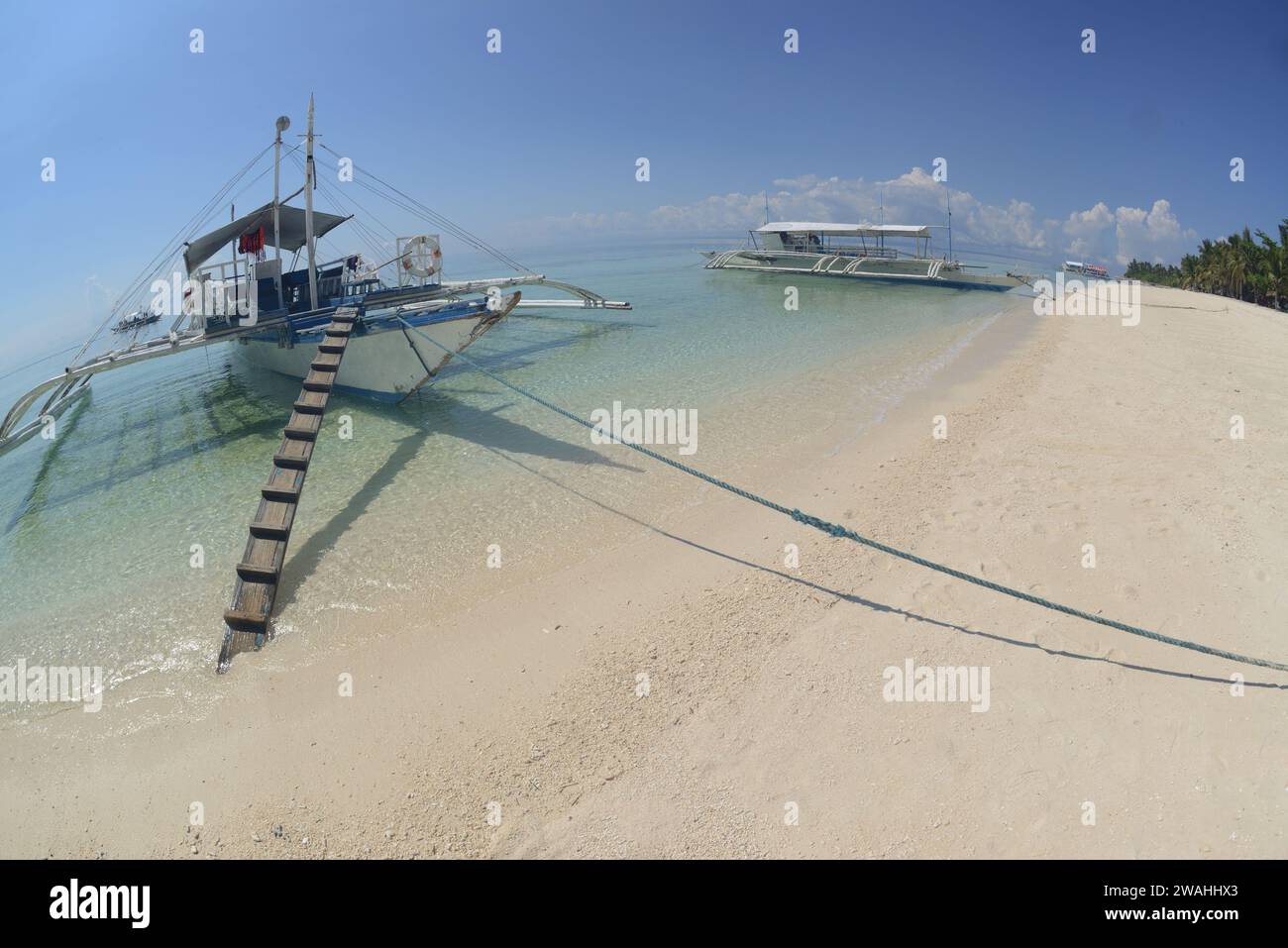 Local traditional Filipino boats or Outrigger boat moored at the ...