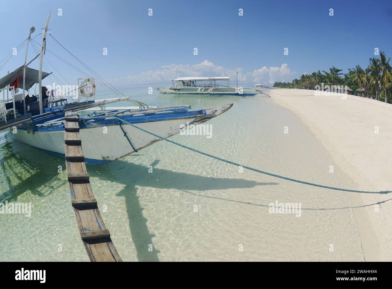 Local traditional Filipino boats or Outrigger boat moored at the ...
