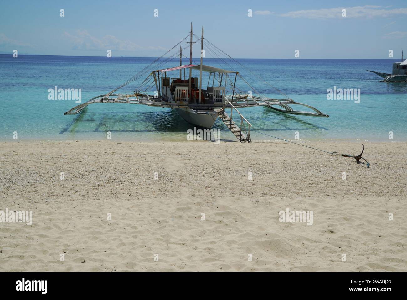 Local traditional Filipino boats or Outrigger boat moored at the ...