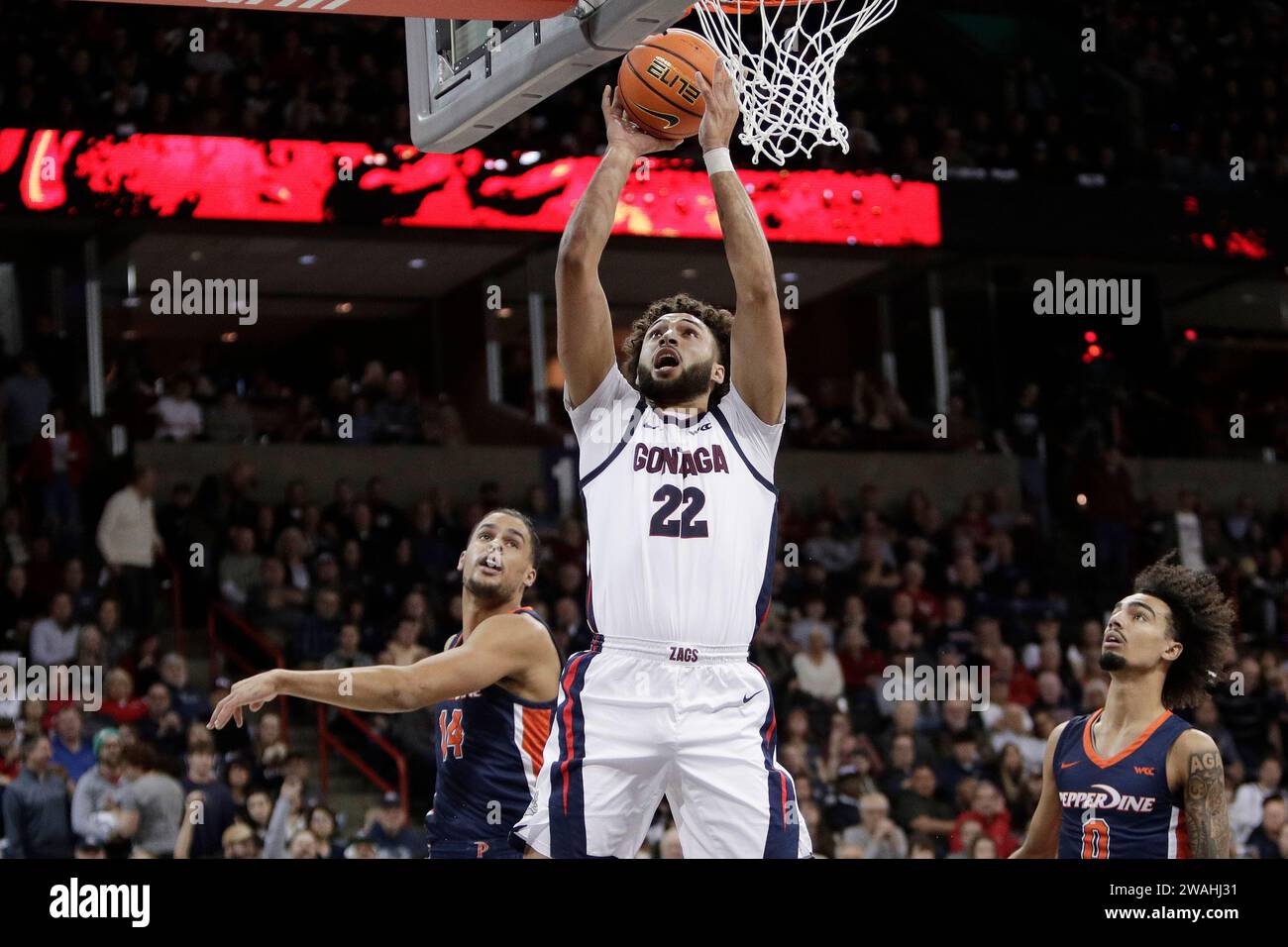 Gonzaga forward Anton Watson (22) shoots next to Pepperdine forward ...