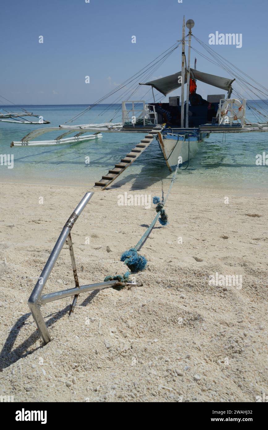 Filipino boat on white sandy beach in Boracay, Philippines Stock Photo ...
