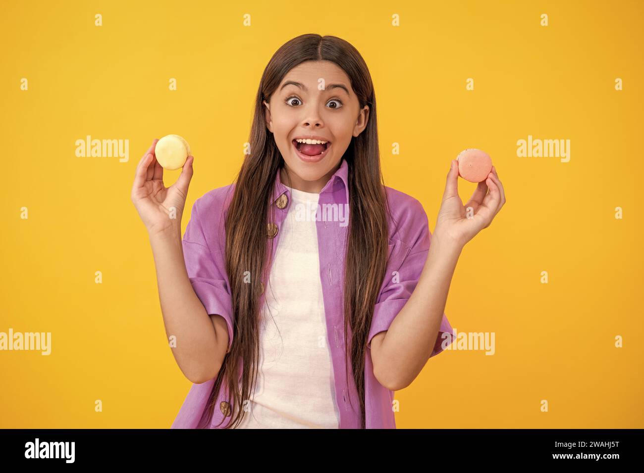 yummy macaroon dessert. surprised teen girl savoring a macaron. Sweet ...