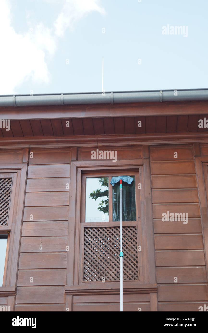 Rubber squeegee cleans a soaped window Stock Photo - Alamy
