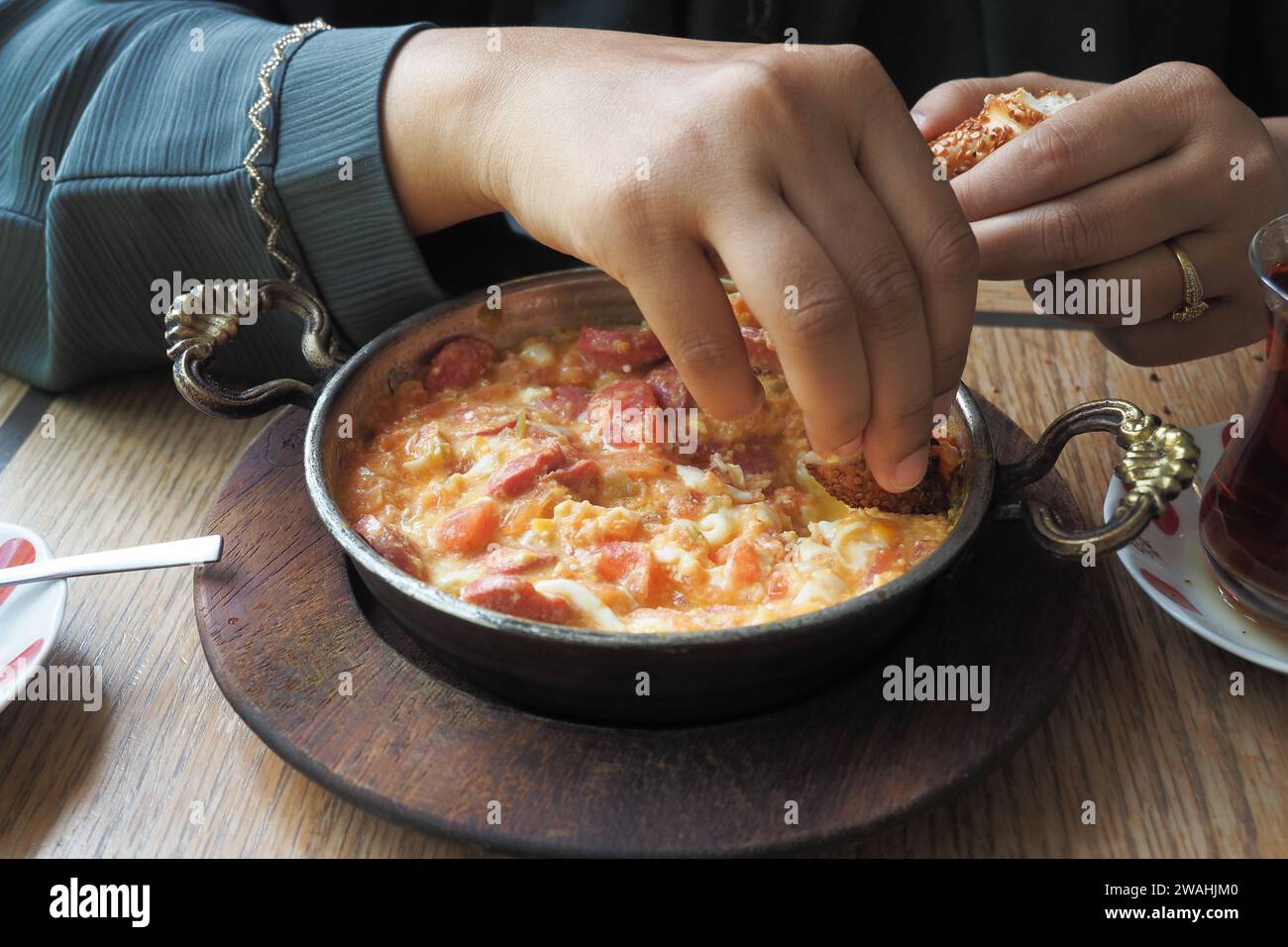 women eating Turkish Menemen omelet in a frying pan Stock Photo - Alamy
