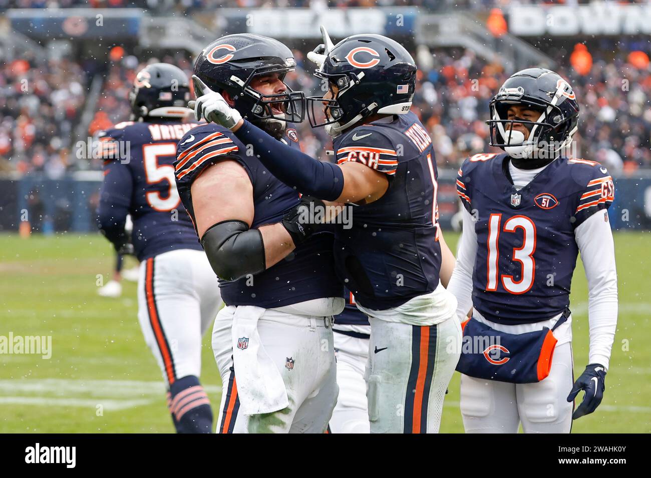 Chicago Bears quarterback Justin Fields (1) celebrates with guard Lucas ...