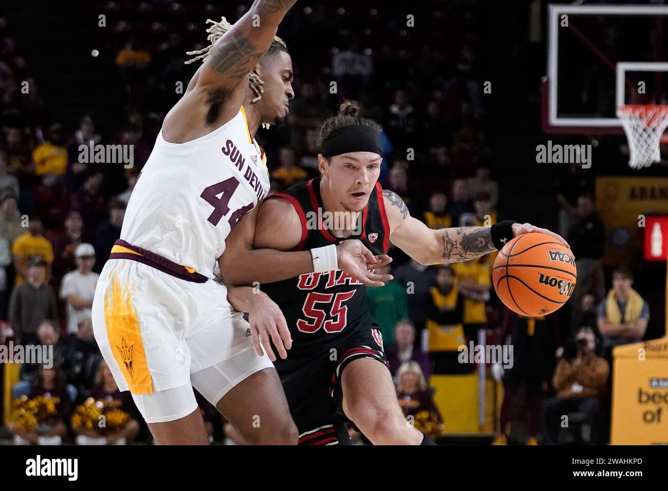 Utah's Gabe Madsen (55) drives around Arizona State's Adam Miller (44 ...