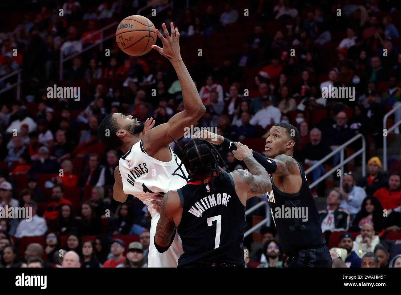 Brooklyn Nets forward Mikal Bridges, left, gets a rebound over Houston ...