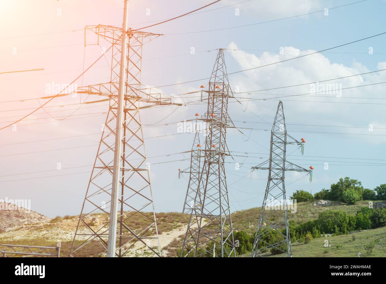 High voltage towers with sky background. Power line support with wires ...