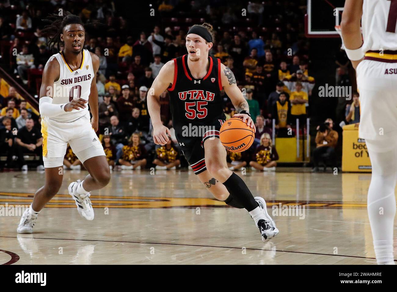 GLENDALE, AZ - JANUARY 04: Utah Utes guard Gabe Madsen (55) drives to ...