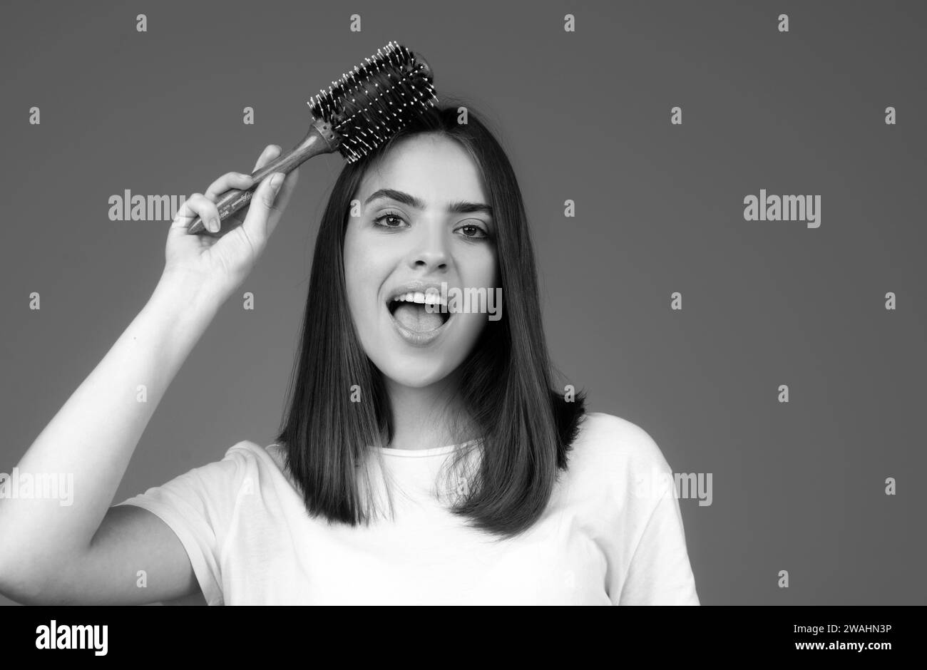 Woman Combing Hair Portrait Of Female Model With A Comb Brushing Hair Girl With Hairbrush