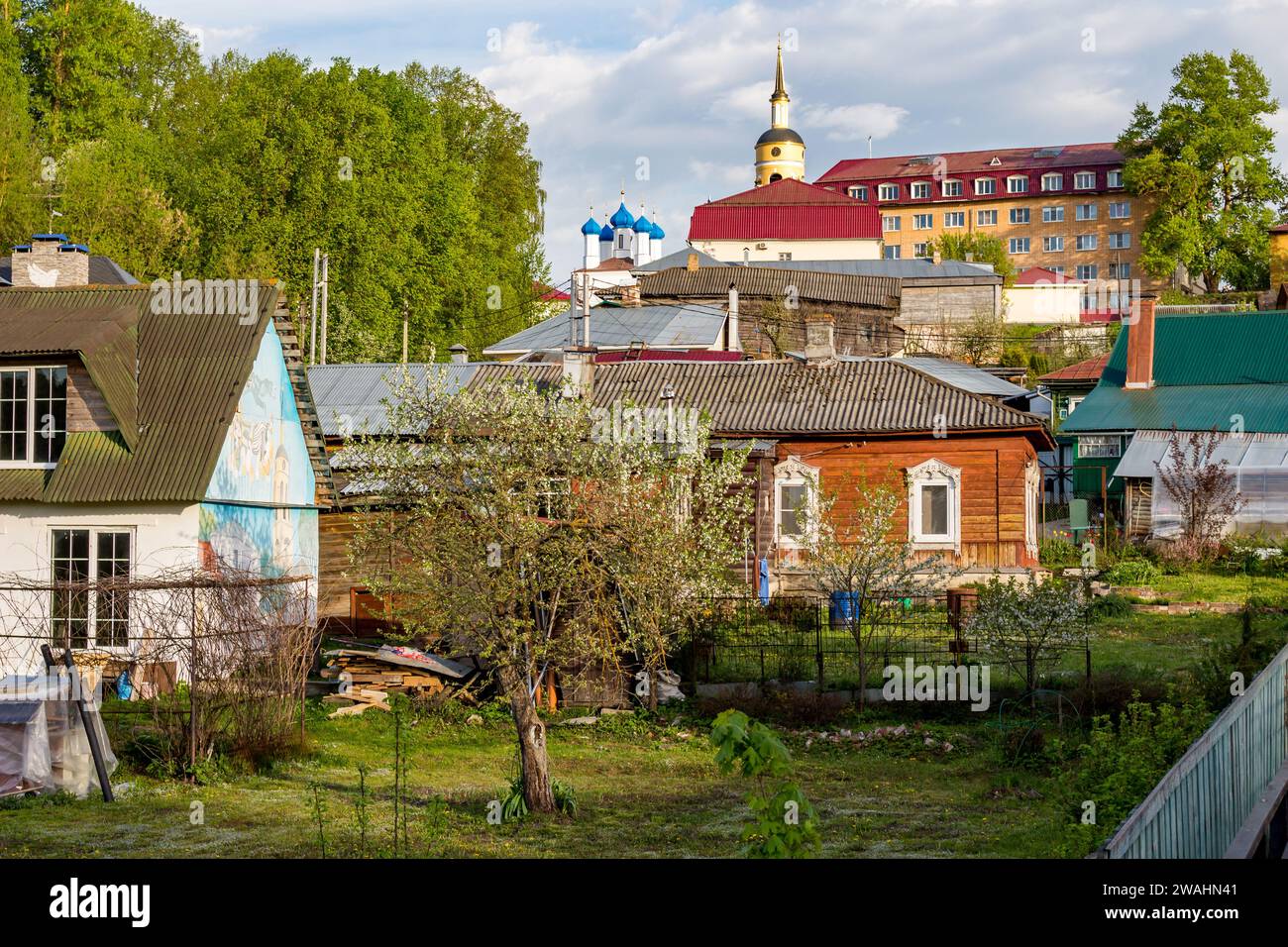 View of the picturesque rural buildings with houses and vegetable ...