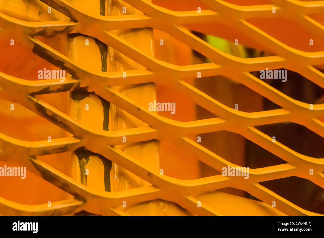 Macro of yellow metal structure with v-shaped patterns Stock Photo - Alamy