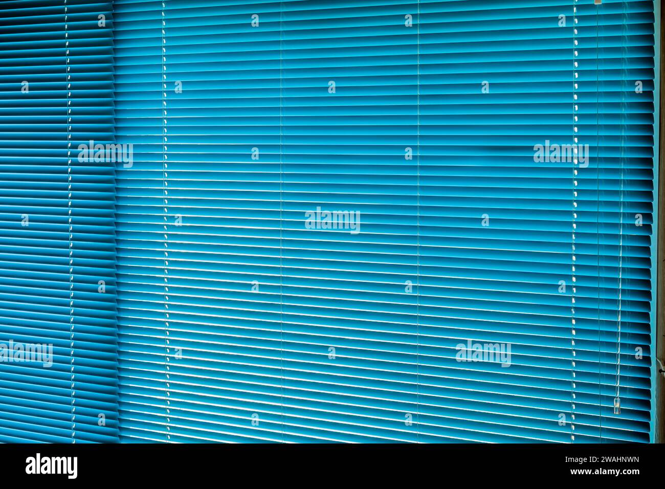 Blue window blinds on window on with sun shinning through Stock Photo ...