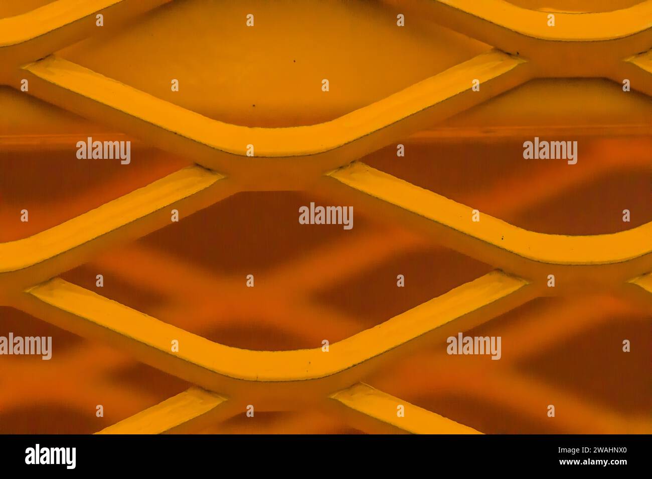 Macro of yellow metal grate with blurred background Stock Photo - Alamy