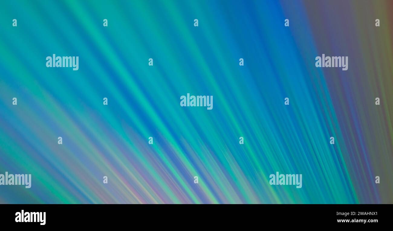 Abstract macro of light rays reflected off compact disk producing ...