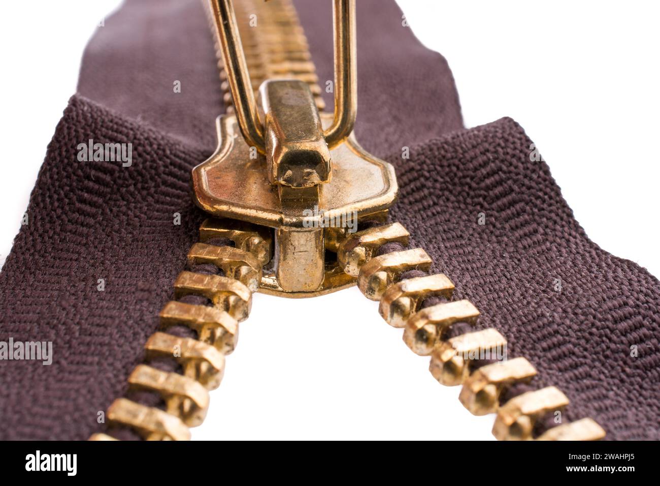 Close up or macro of a brown zipper on white background Stock Photo - Alamy