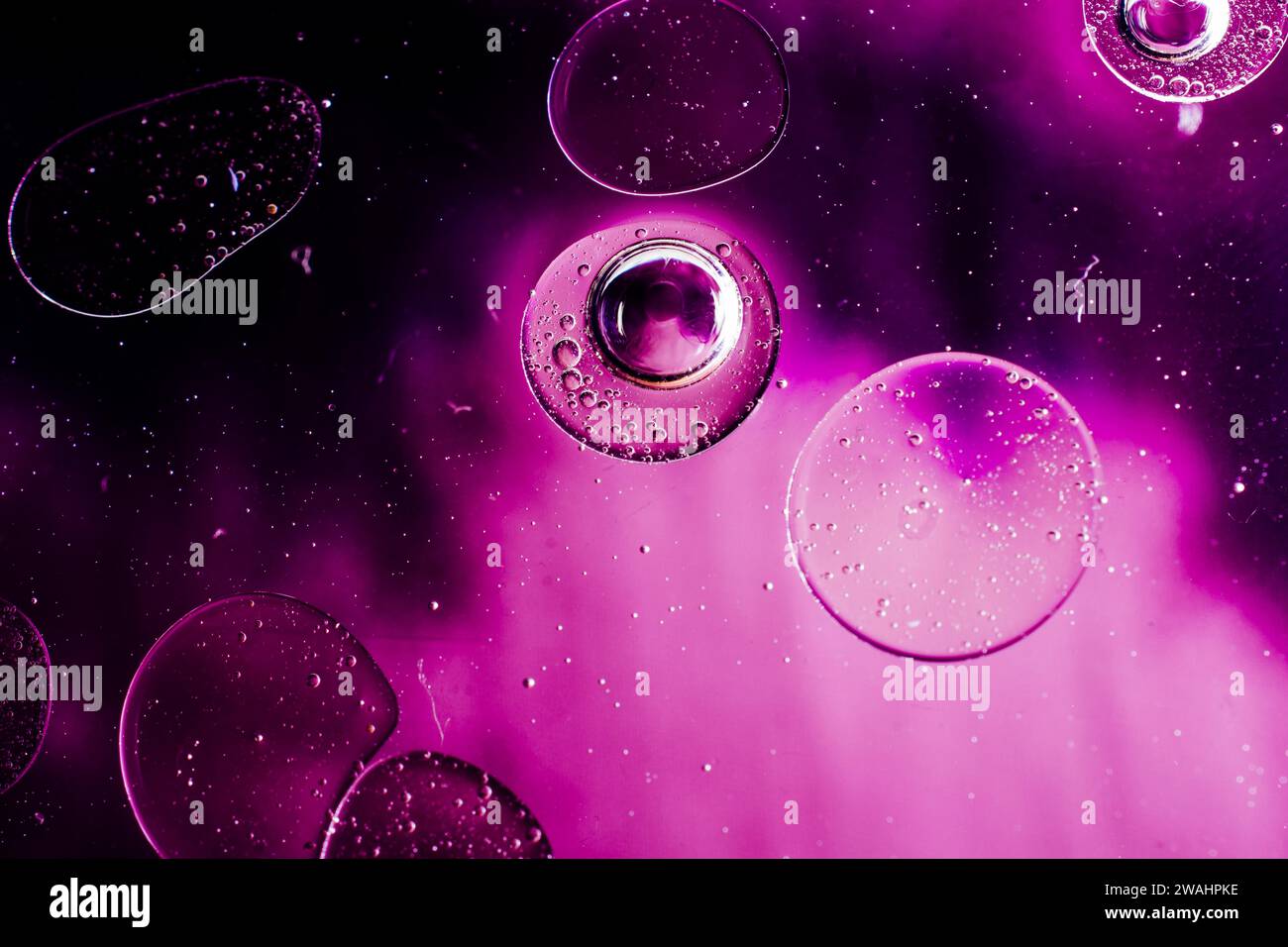 Oil bubbles inside water base form patterns Stock Photo - Alamy