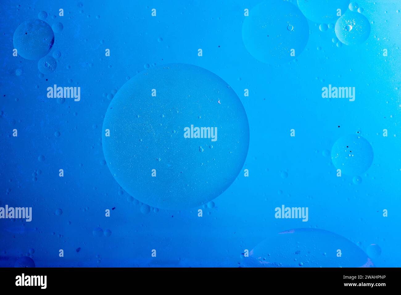 Oil bubbles inside water base form patterns Stock Photo - Alamy
