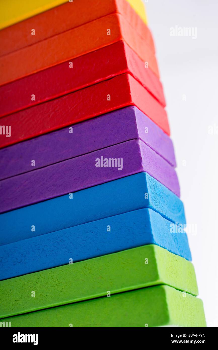 Colorful Domino Blocks in a line on a white background Stock Photo - Alamy